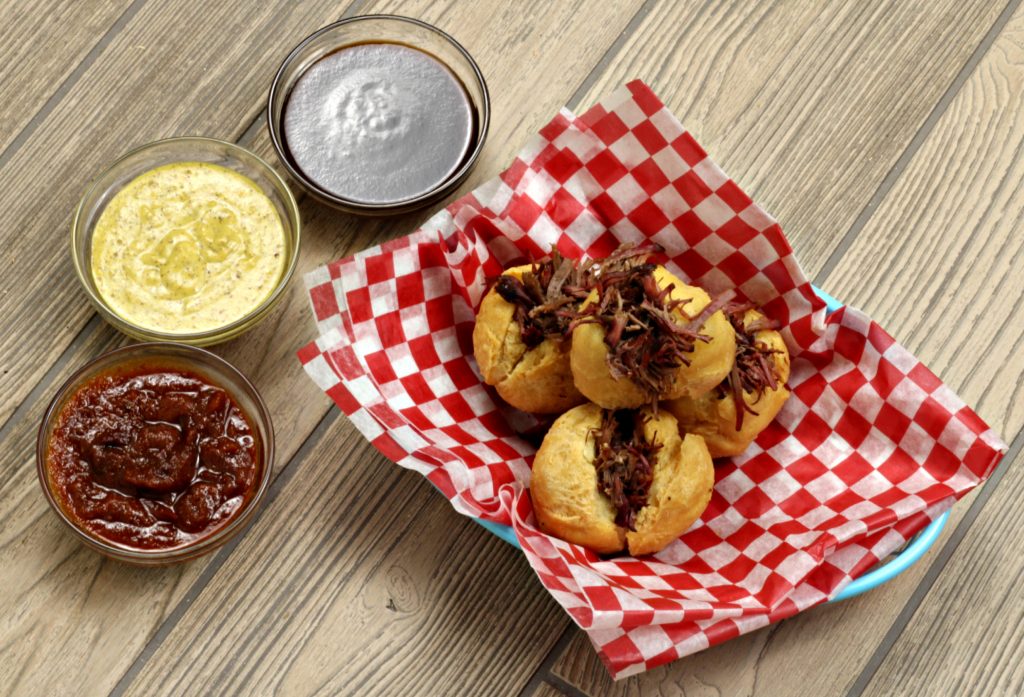Pulled Beef Filled Mini Doughnuts With a Trio of BBQ Dipping Sauces